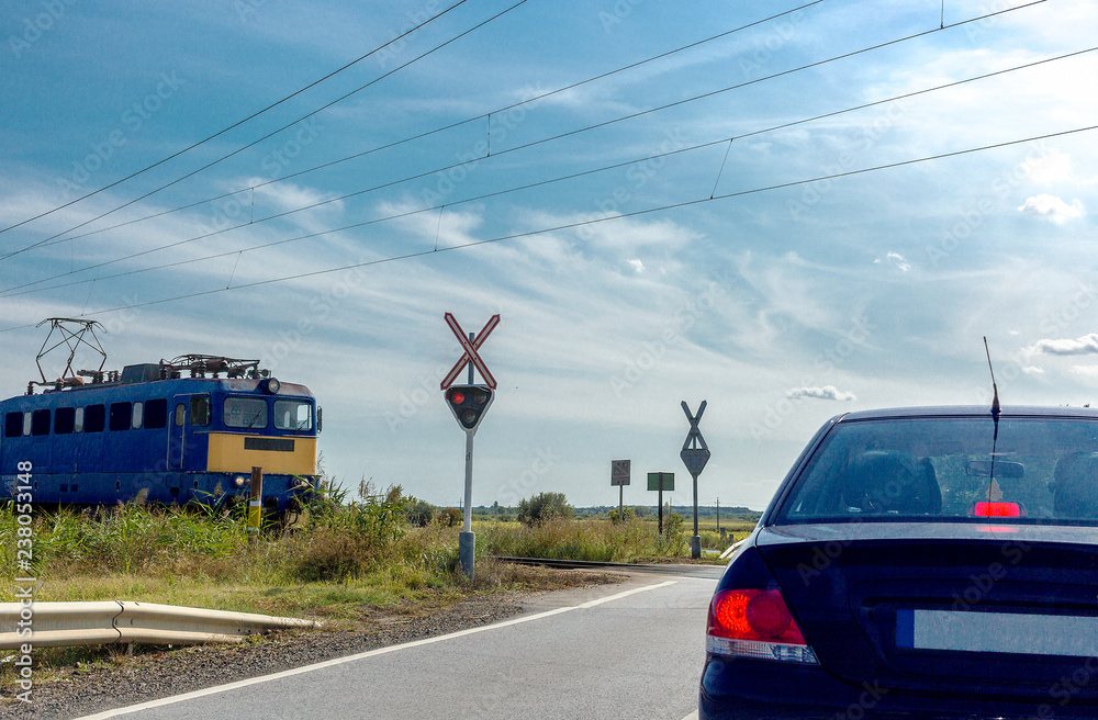 Poster The electric train approaching railroad crossing – Wall Art ...