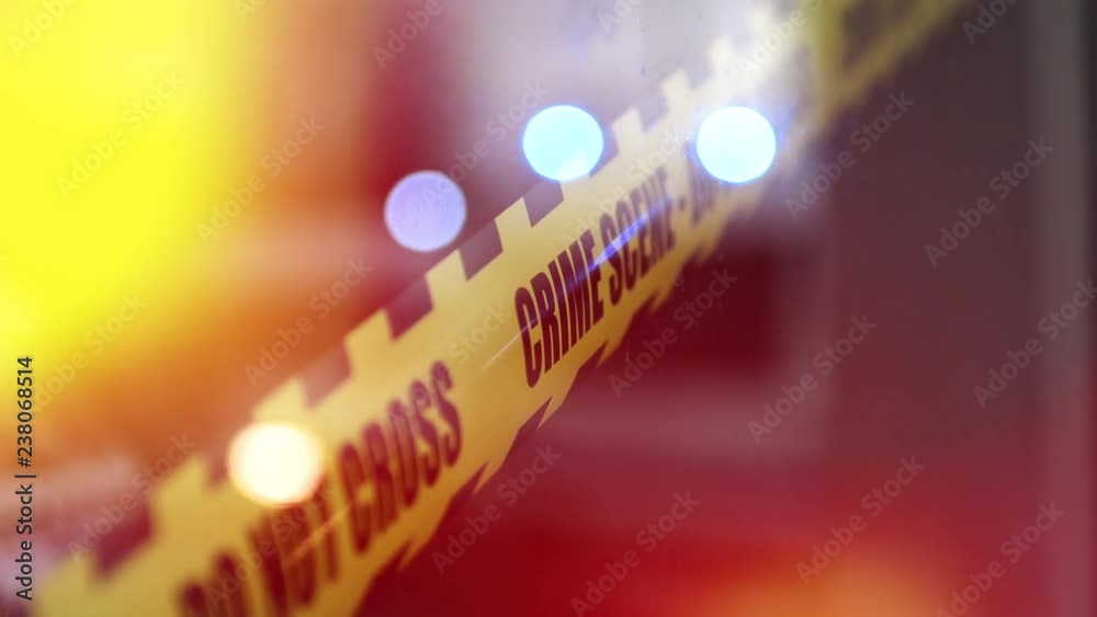 Police scene do not cross sign on the window of a store where murder ...