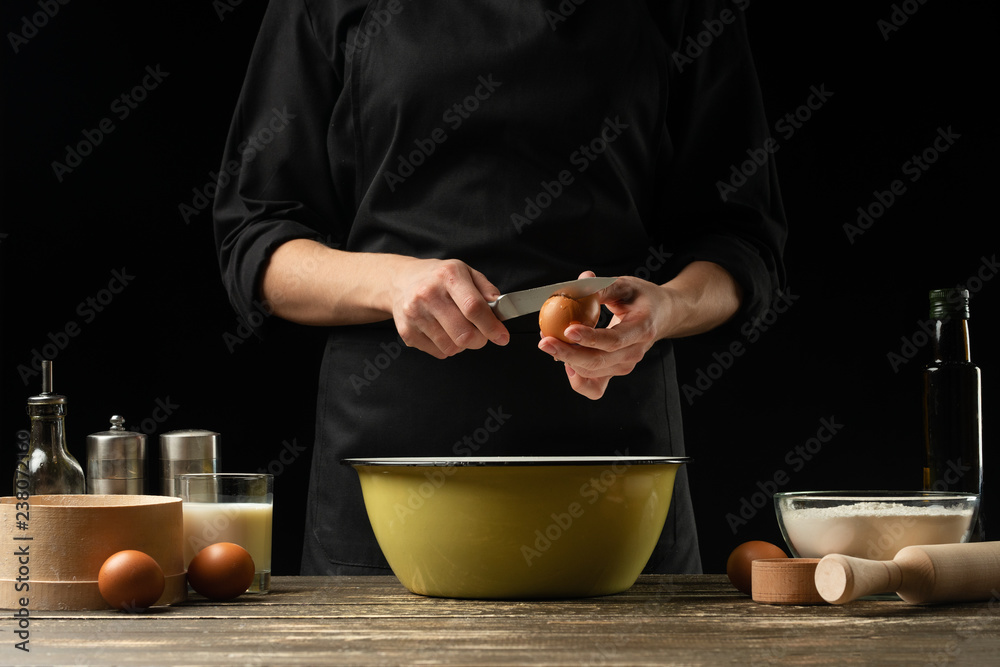 The chef prepares homemade Italian pizza, sweets, bread. A concept for ...