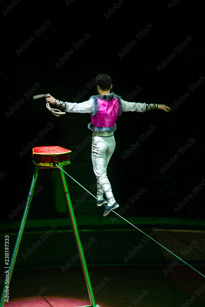 Acrobat walking on a rope during a performance in the circus Stock ...