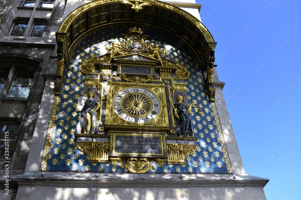 The Conciergerie, Ile de la Cite, Paris, France. Clock closeup with sun ...