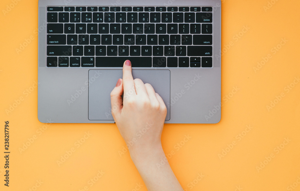 Сlose-up photo of a woman's hand pushing the space bar on the keyboard ...