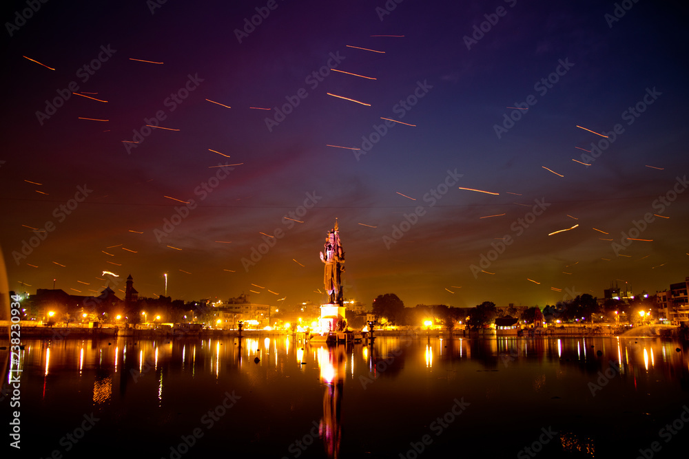 long exposure of spectacular fire trails in the dusk sky caused by fire ...