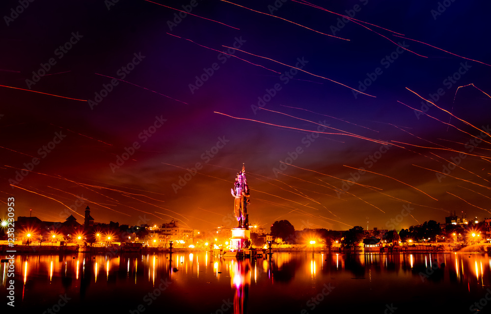 long exposure of spectacular fire trails in the dusk sky caused by fire ...