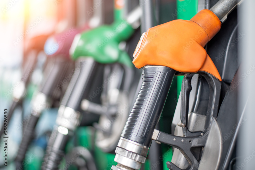Pumping equipment gas at gas station. Close up of a hand holding fuel ...
