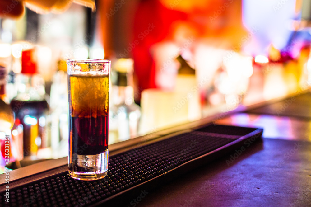 colored and beautiful Chupito drink with bokeh blurred background of an ...