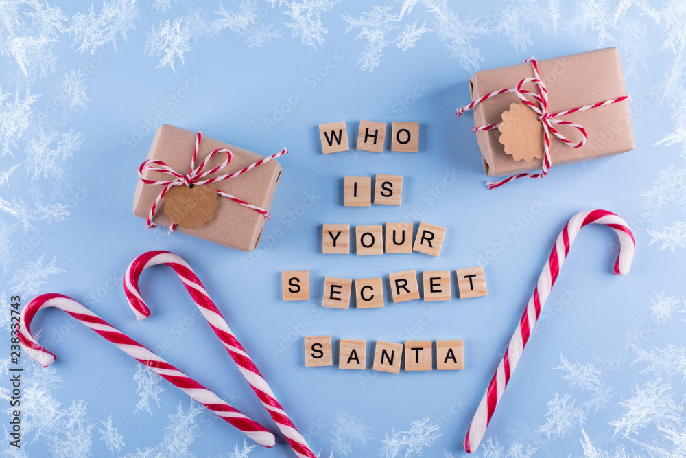 Secret Santa christmas game. Wrapped gift boxes with notes candy cane ...