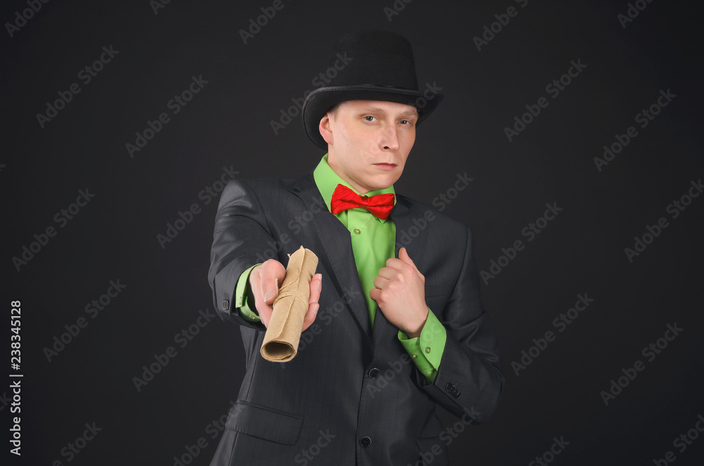 Spy secret agent with bowler hat on his head is showing a top secret ...