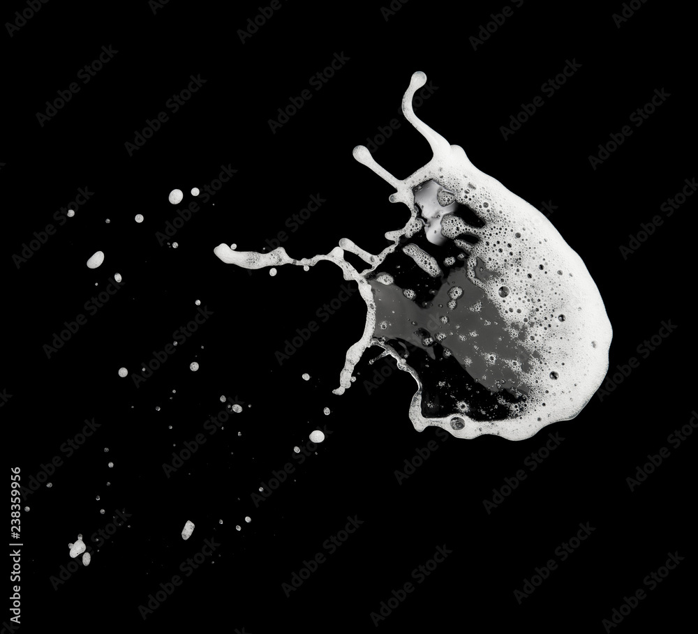 White bubble foam splash explosion in the air on black background ...