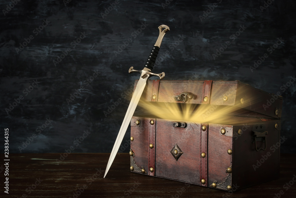 low key image of beautiful queen/king crown, open chest with treasure ...