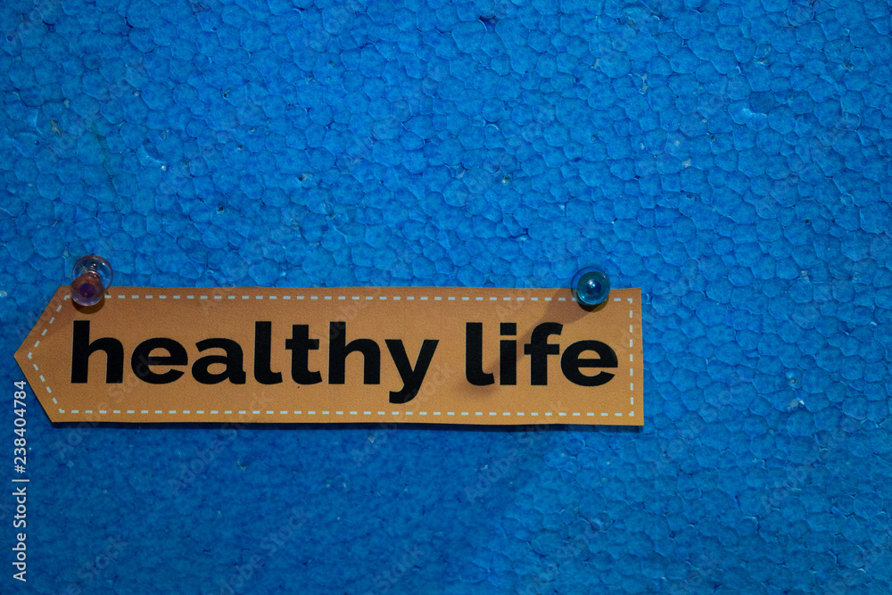 Healthy Life text on the paper is attached to the styrofoam with push ...