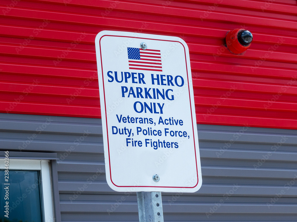 parking sign appreciating veterans, active duty, police force, and fire ...