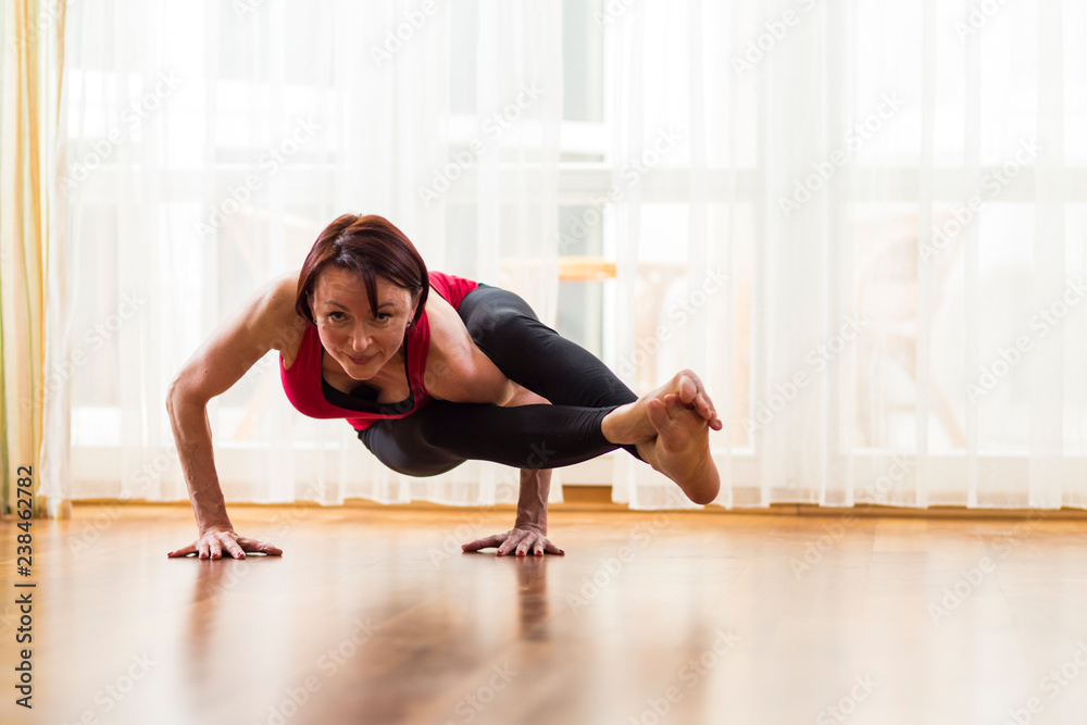 Yoga Concepts. Caucasian Woman Practicing Yoga Exercise Indoors At ...