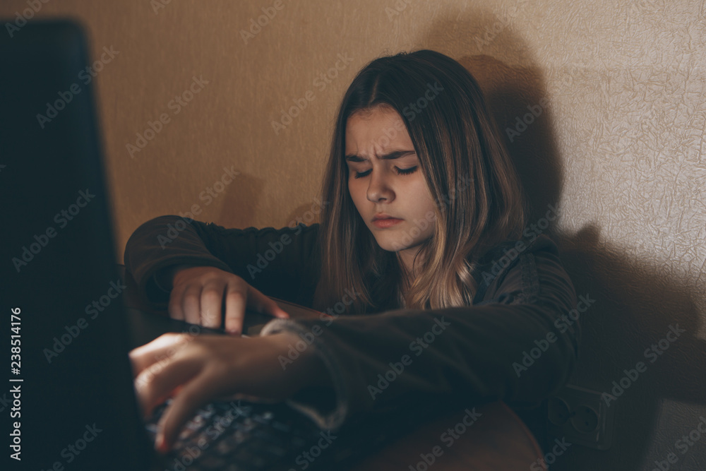 Teenager girl suffering internet cyber bullying scared and depressed ...