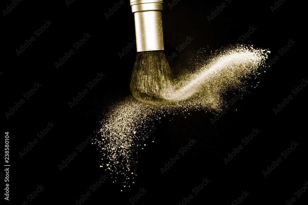 gold powder splash and brush for makeup artist or beauty blogger in ...