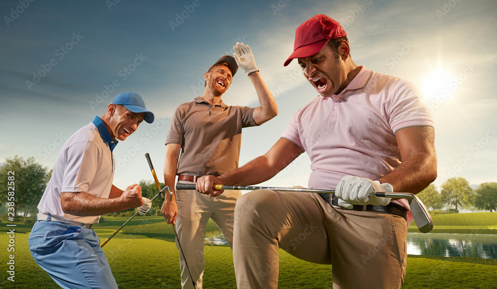 Male golf players on professional golf course. Happy player emotionally ...