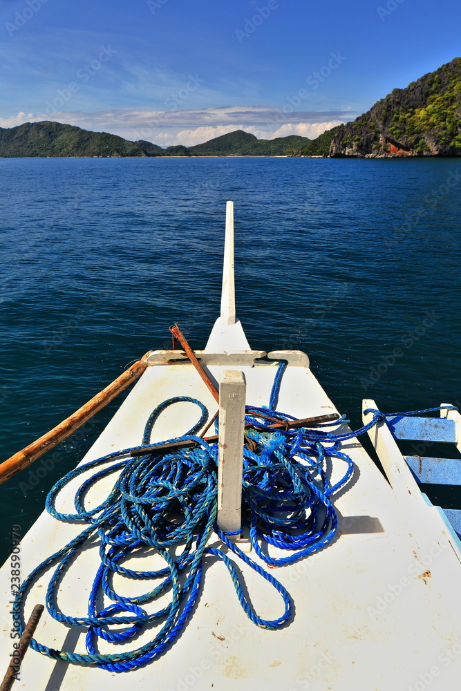Sailing Bacuit bay-ship's bow heading to Pagauanen bay. El Nido-Palawan ...