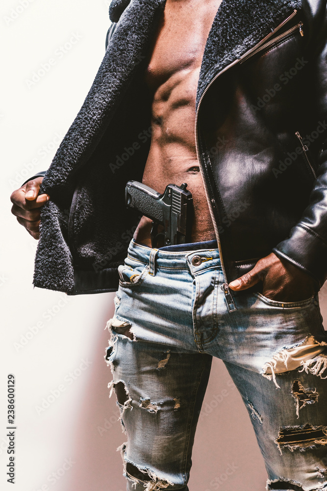 Anonymous black man with gun Stock Photo | Adobe Stock