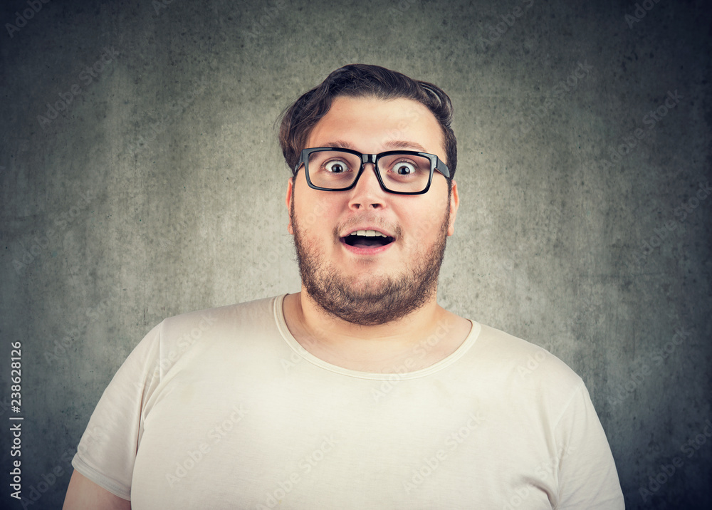 Excited chunky man looking at camera Stock Photo | Adobe Stock