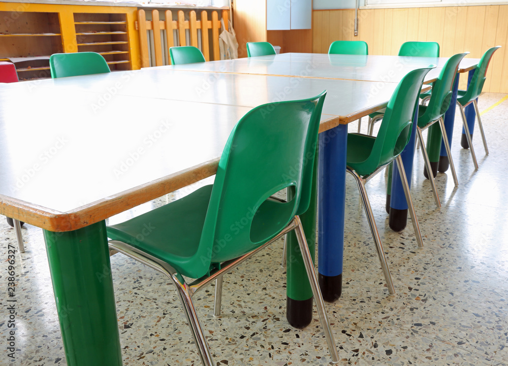 classroom of a school with green chairs and low tables suitable Stock ...
