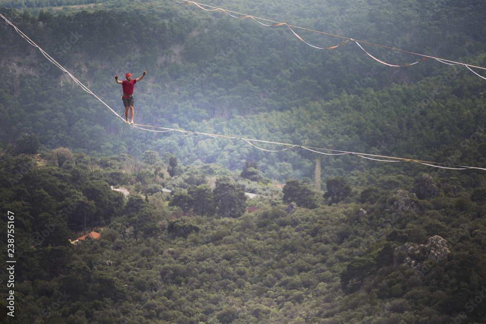 Highliner on a rope. Highline on a background of mountains. Extreme ...