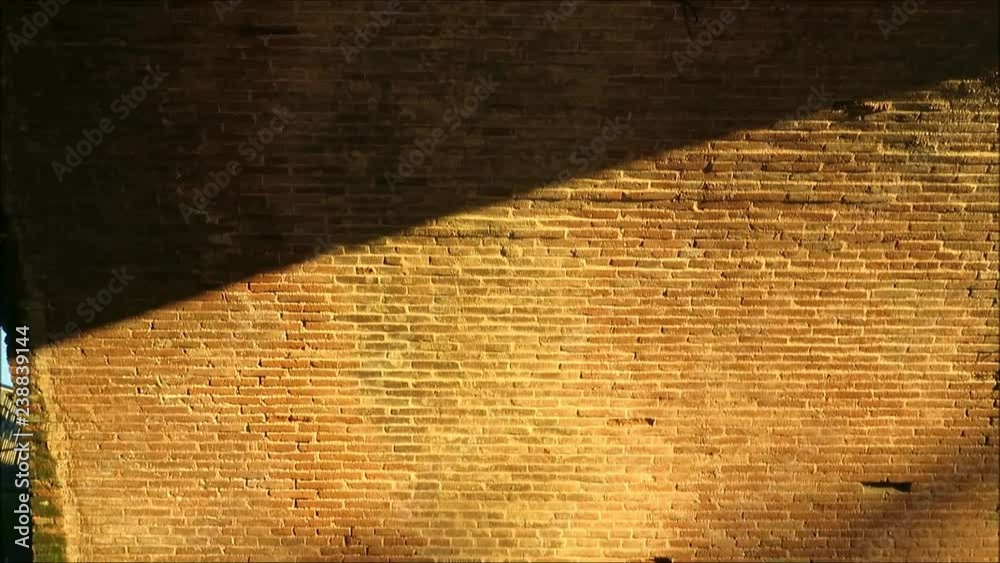 Wide tall brick built arched road bridge in rural Andalusian autumn ...