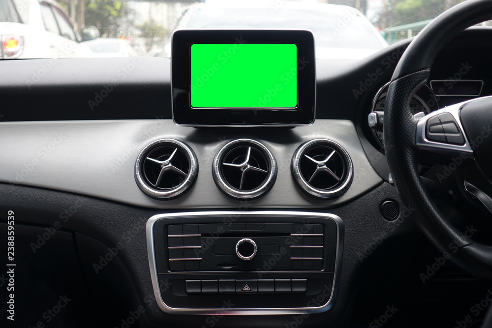 Blank green screen of monitor inside a modern car interior using for ...