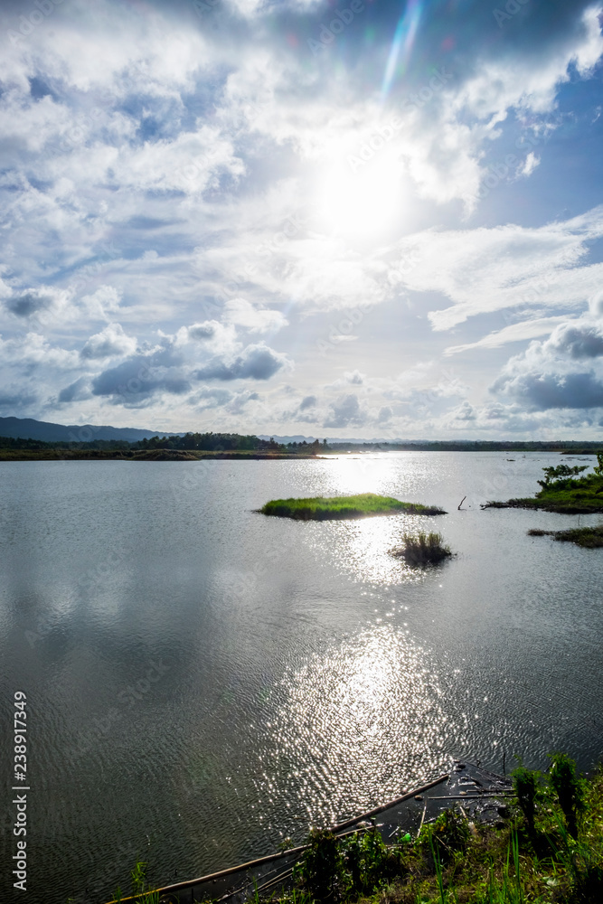 Pilar dam. Lake water, sun and clouds. Bohol Stock Photo | Adobe Stock
