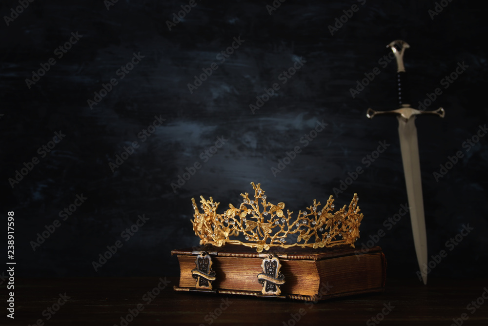 low key image of beautiful queen/king crown and sword. fantasy medieval ...