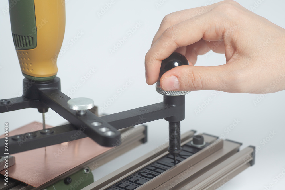 Worker hands on Engraving device pantograph with CNC engraver with ...