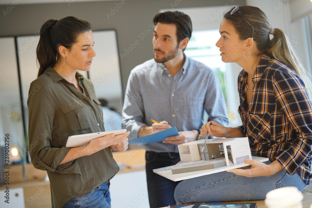 Architects looking over project for modern house design Stock Photo ...