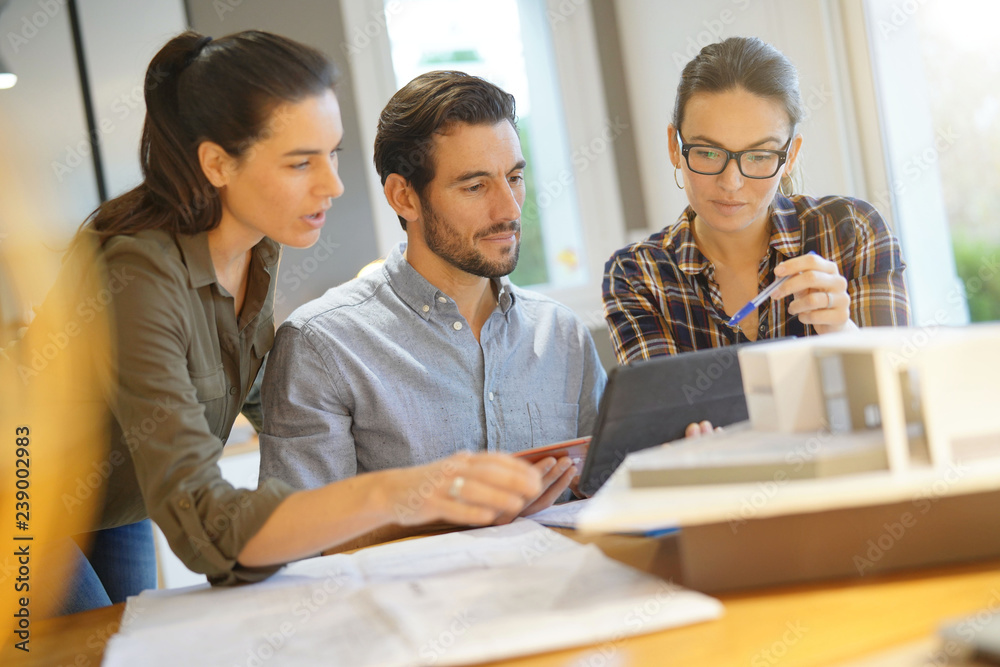 Architects looking over project for modern house design Stock Photo ...