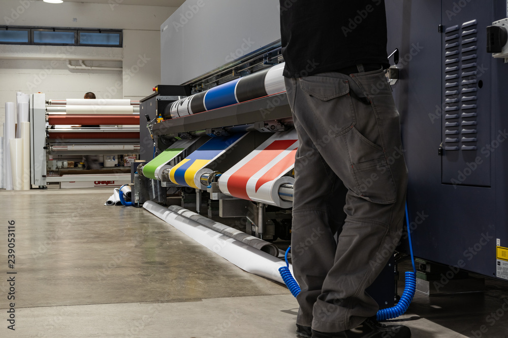 Very big printer during color sample phase, massive vinyl rolls ...