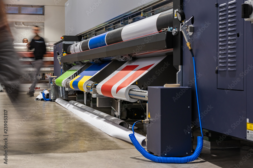 Very big printer during color sample phase, massive vinyl rolls ...