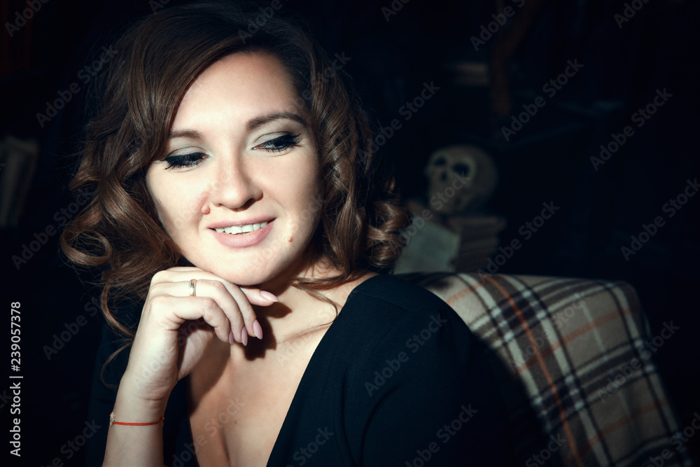 Beautiful model is posing in a dark studio Stock Photo | Adobe Stock