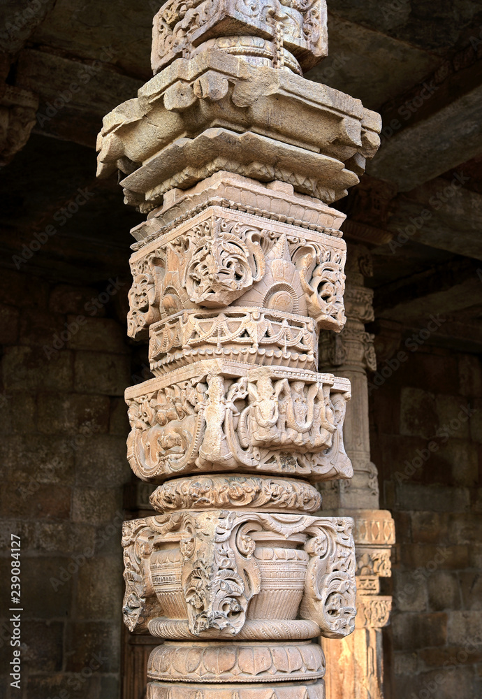 Column with stone carving at the famous Qutub complex an array of ...