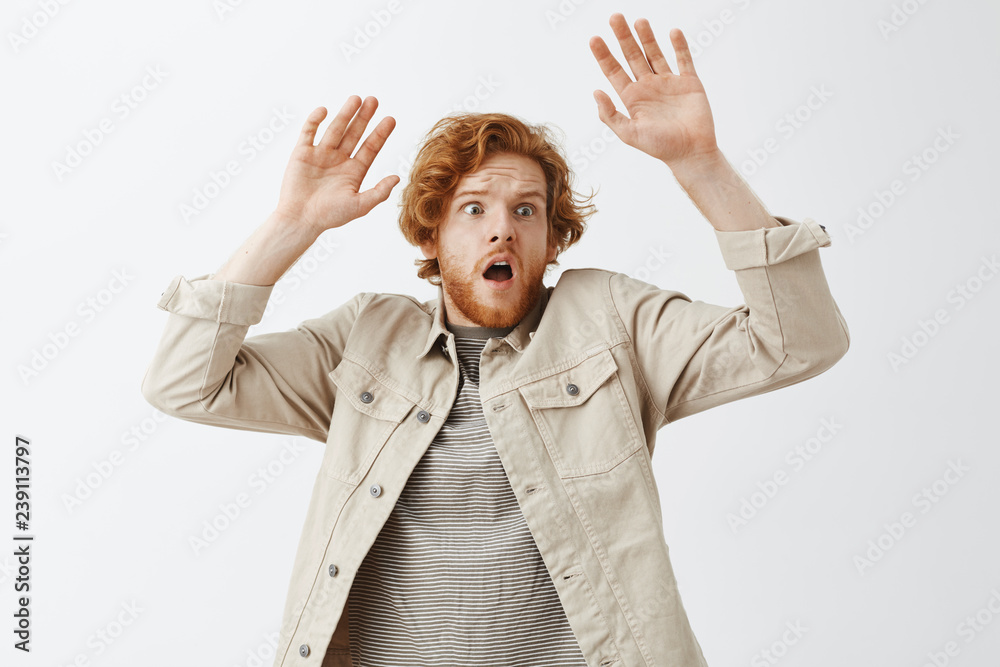 Panicking frightened insecure redhead guy gasping with opened mouth ...