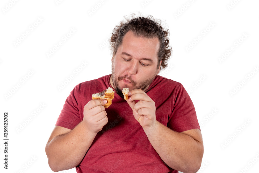 Funny fat man eating small croissant on white background. Good morning ...