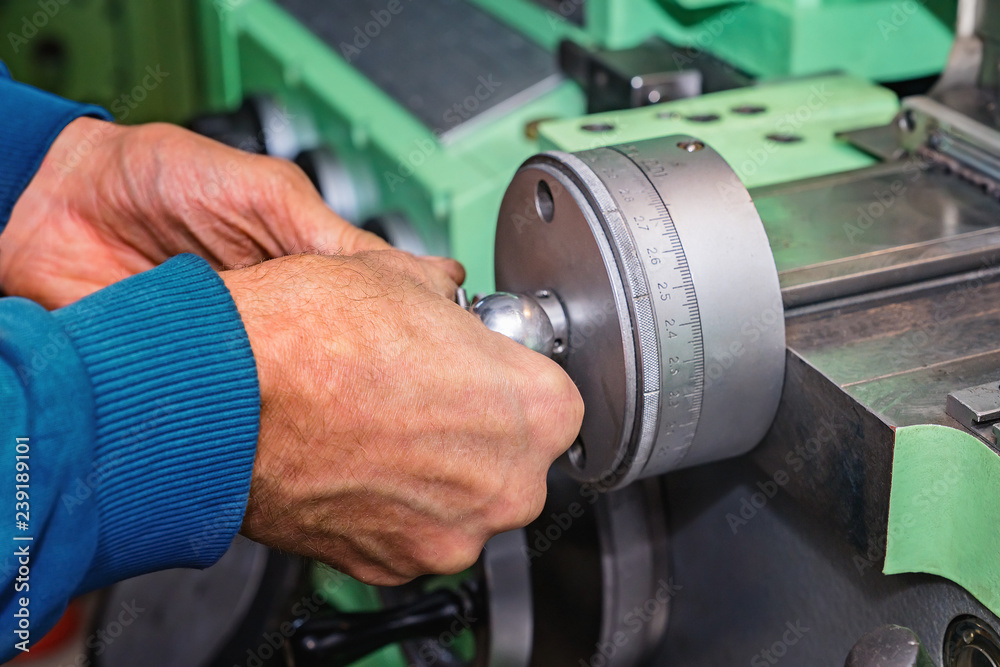 Mens hands on a cross feed handwheel of lathe machine Stock Photo ...