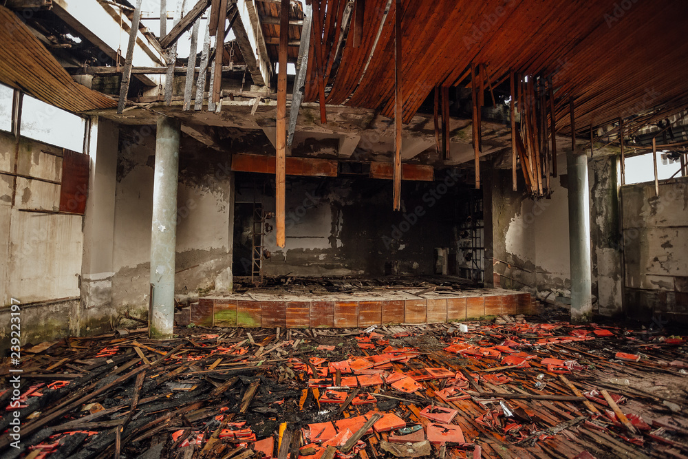 Dark creepy interior ruined collapsed abandoned stage or cinema theater ...