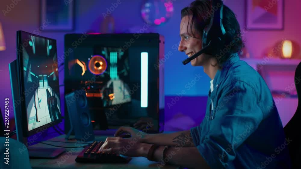 Close Up of an Excited Gamer Putting On His Headset with a Mic and ...