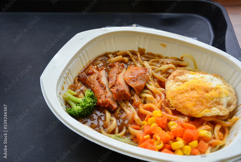 noodle with spicy sauce, sliced chicken, fried egg, broccoli, corn and ...