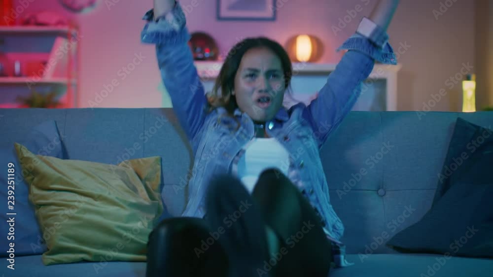 Vidéo Stock Beautiful Excited Young Black Gamer Girl Sitting on a Couch ...