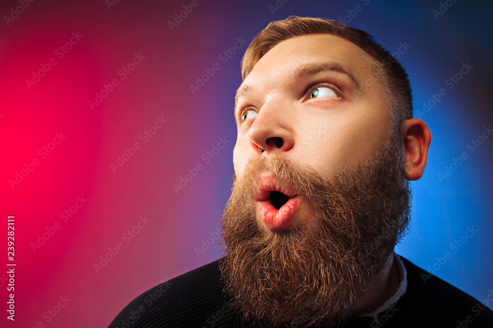 Wow. Attractive male half-length front portrait on colored studio ...