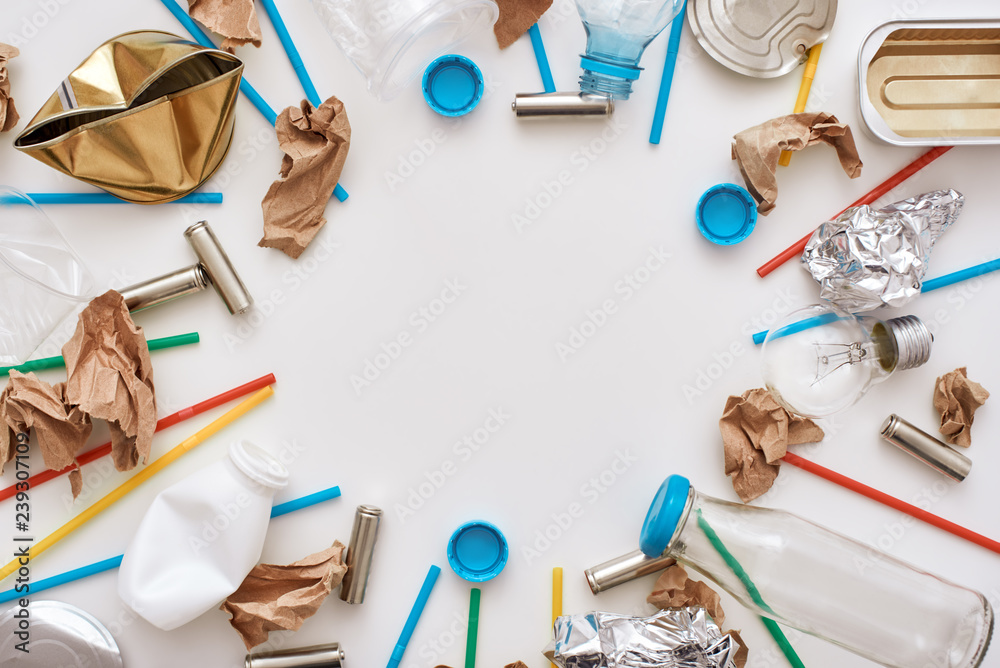 Garbage circle. Different types of unsorted garbage around the floor ...