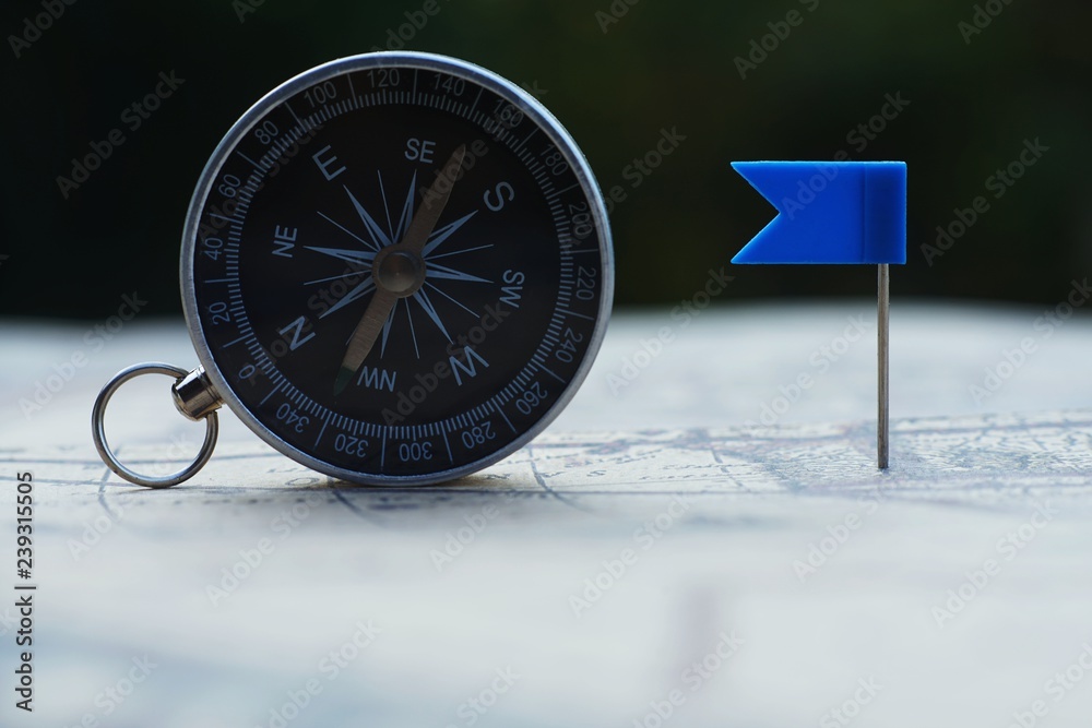 Compass and flag pins on blur vintage world map, journey concept Stock ...