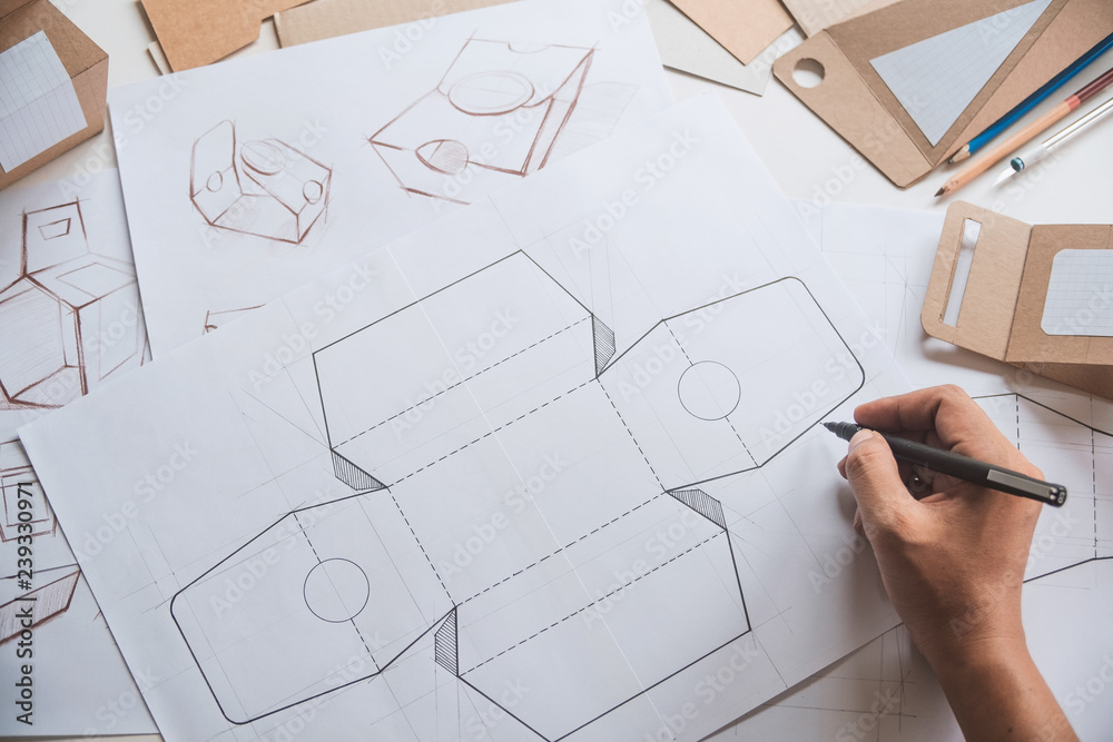 Designer sketching drawing design Brown craft cardboard paper product ...