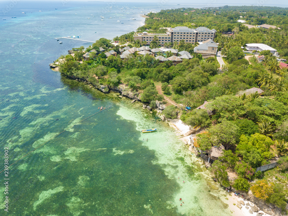 Aerial view of Alona beach with traditional boats. Beautiful tropical ...