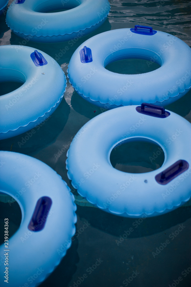 Blue floating rings side by side in a swimming pool. Stock Photo ...