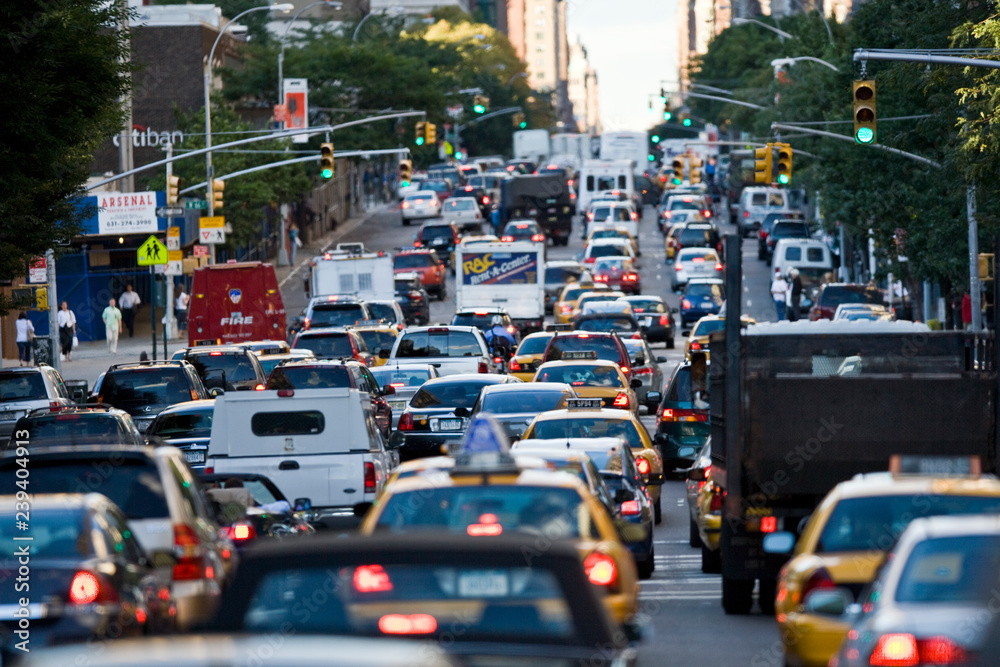 Rush hour traffic in a busy city street. Stock Photo | Adobe Stock